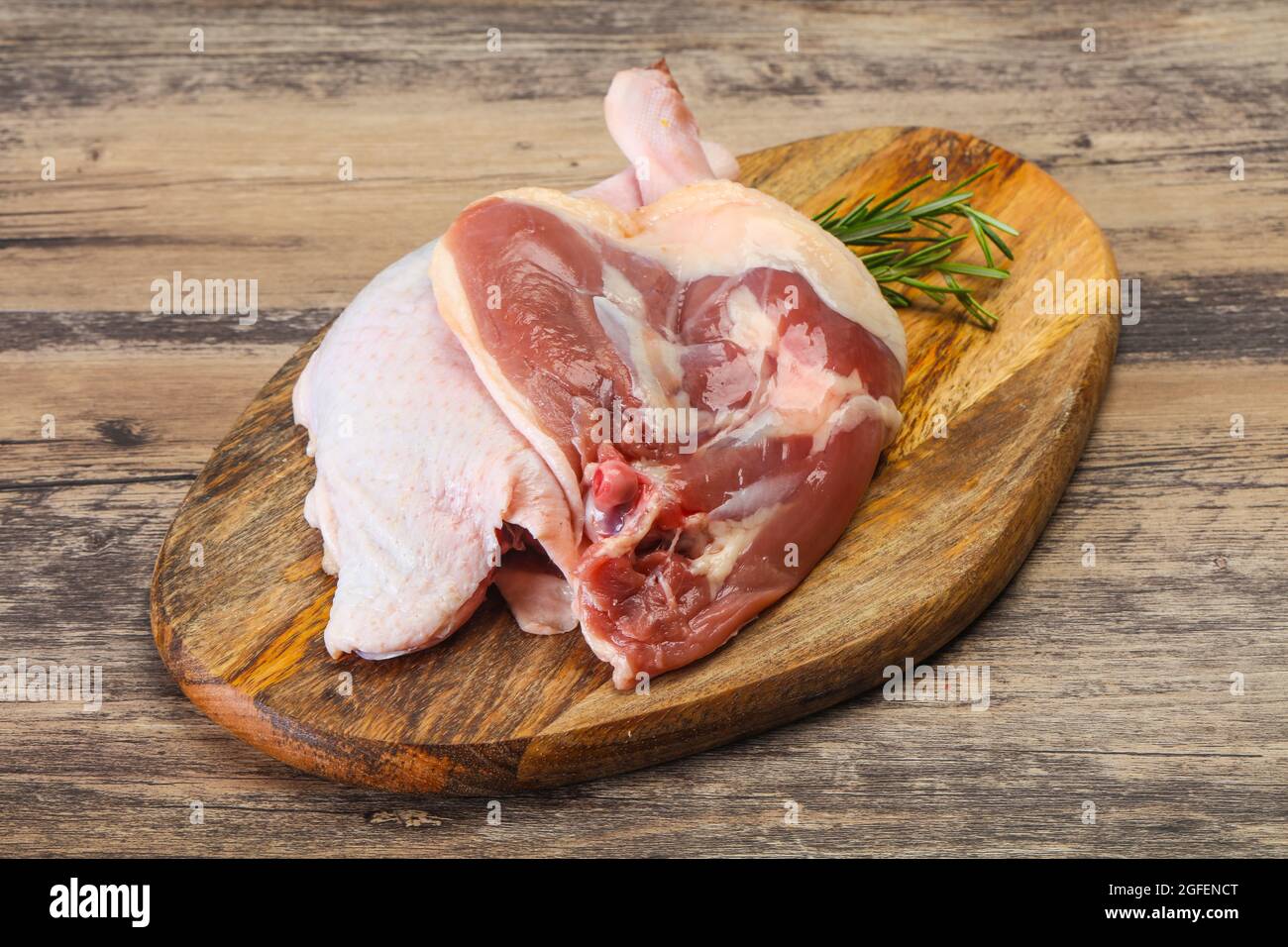 Raw duck leg served rosemary for cooking Stock Photo - Alamy