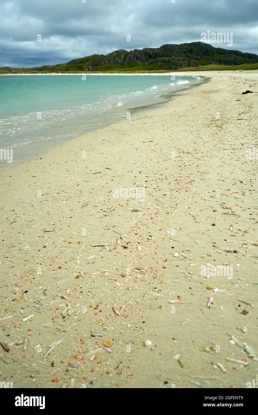 The shell beach at Reef in the Isle of Lewis with the tide line strewn ...