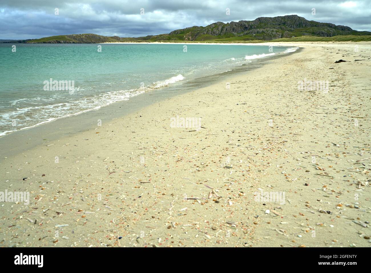 The shell beach at Reef in the Isle of Lewis with the tide line strewn ...