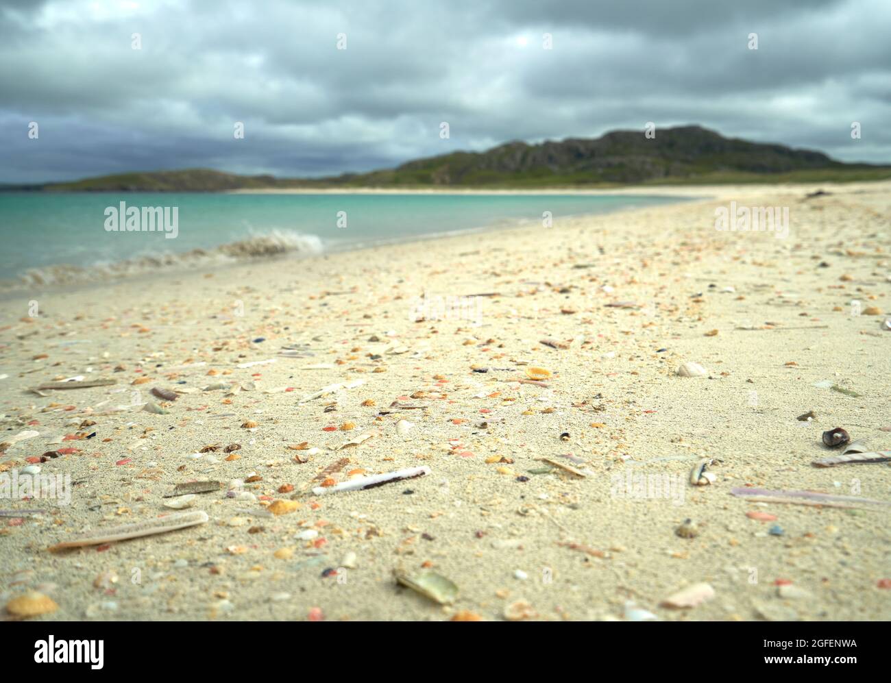The shell beach at Reef in the Isle of Lewis with the tide line strewn ...
