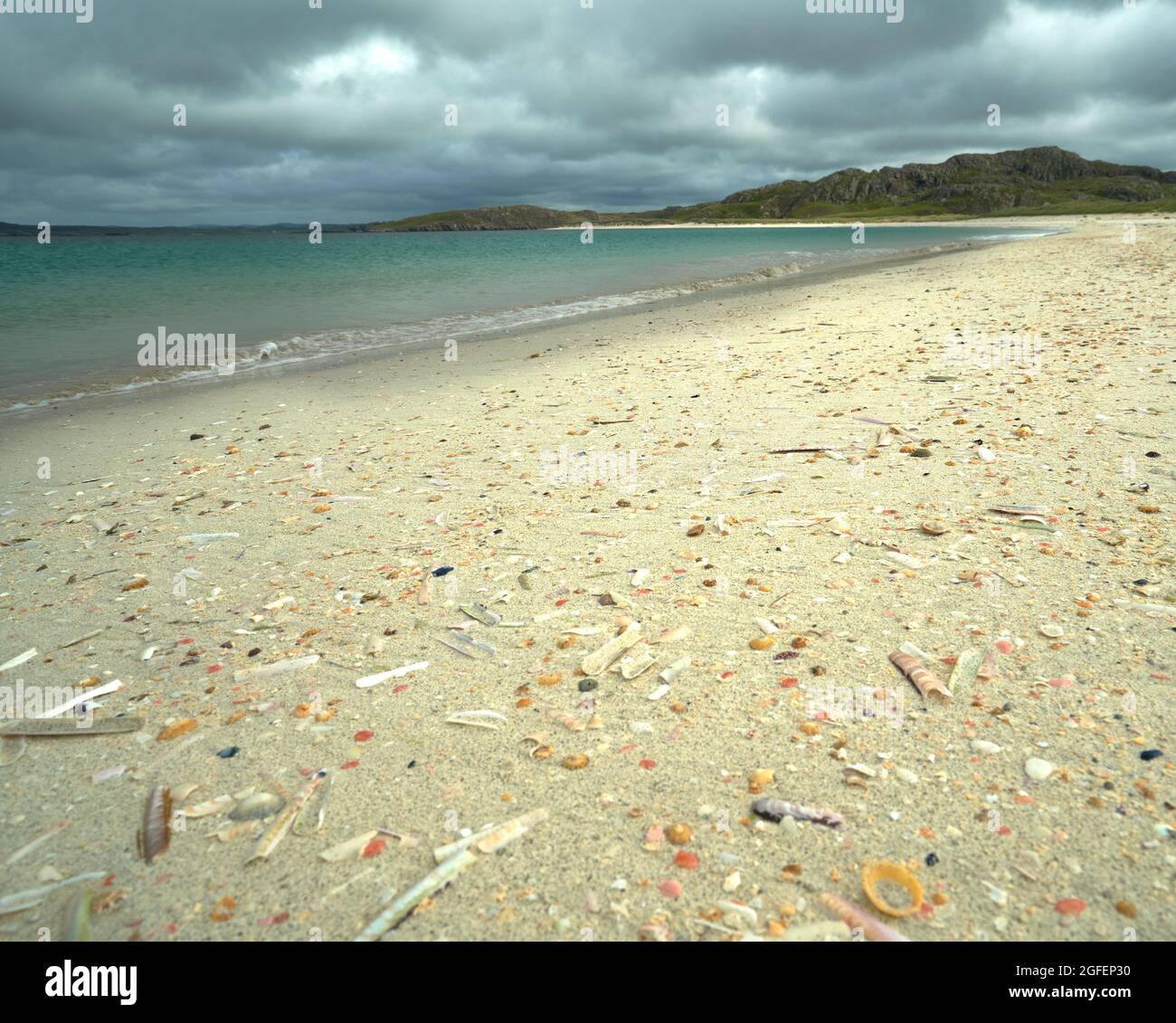 The shell beach at Reef in the Isle of Lewis with the tide line strewn ...