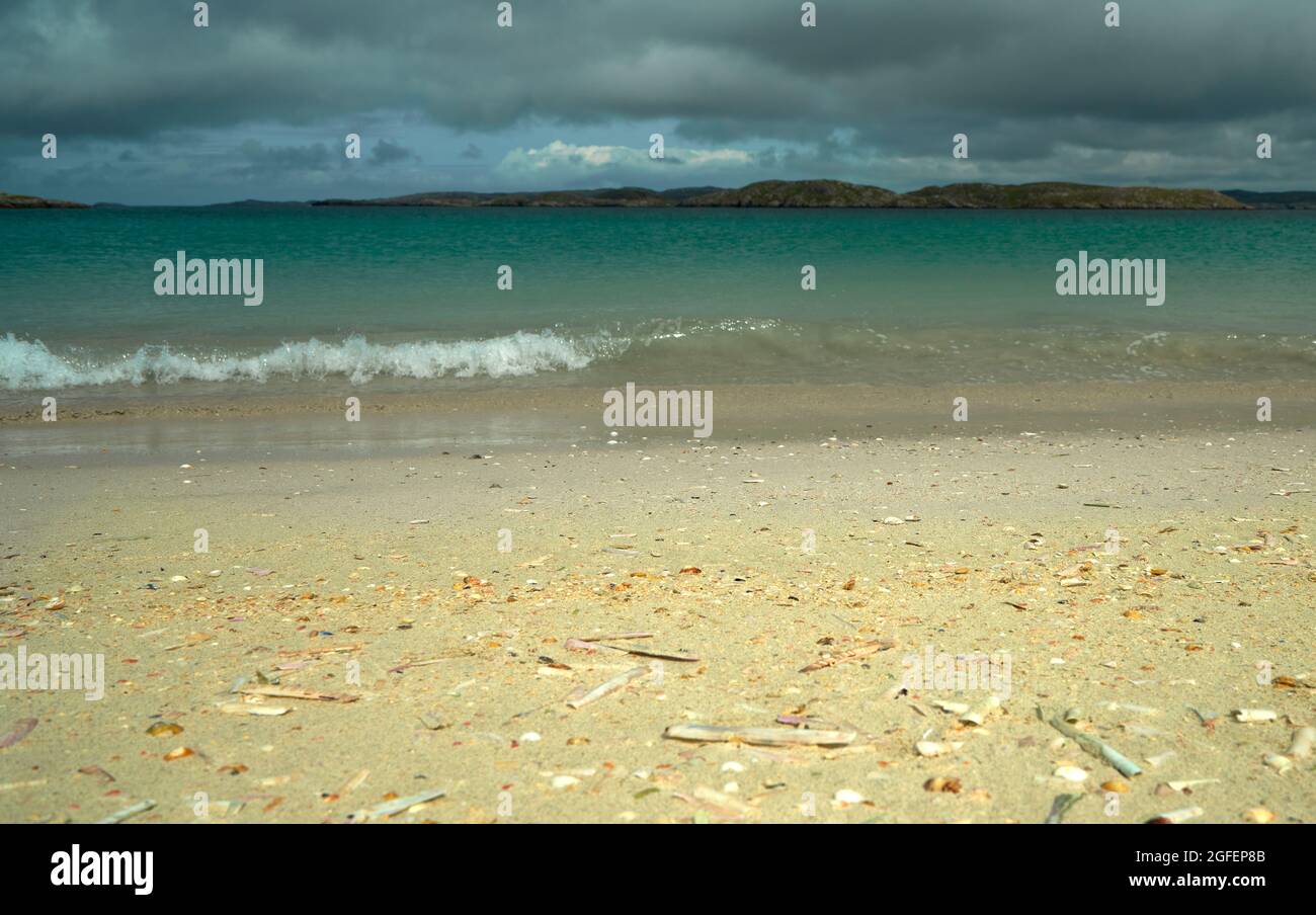 The shell beach at Reef in the Isle of Lewis with the tide line strewn ...