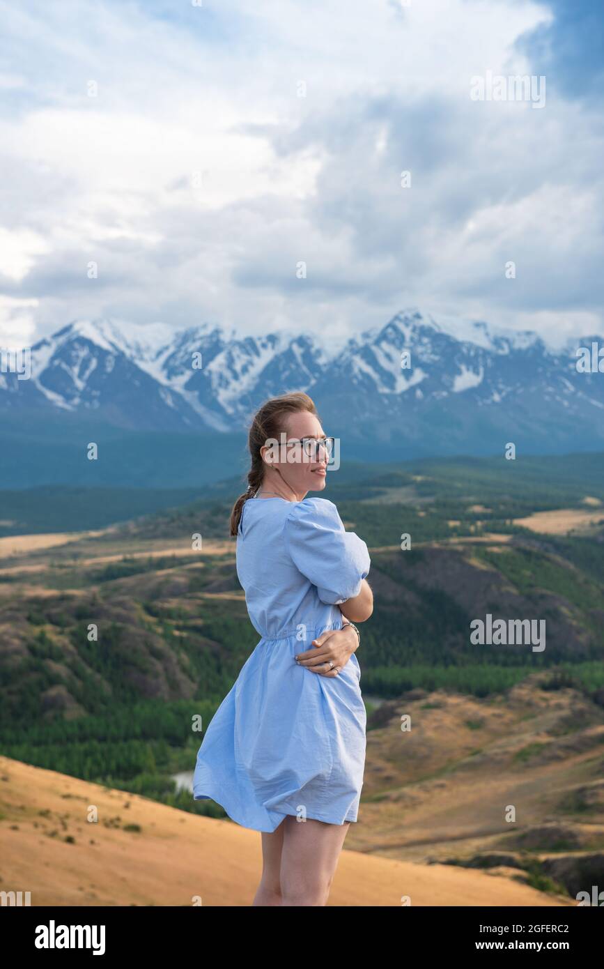 Woman in blue dress in summer Altai mountains in Kurai steppe Stock ...