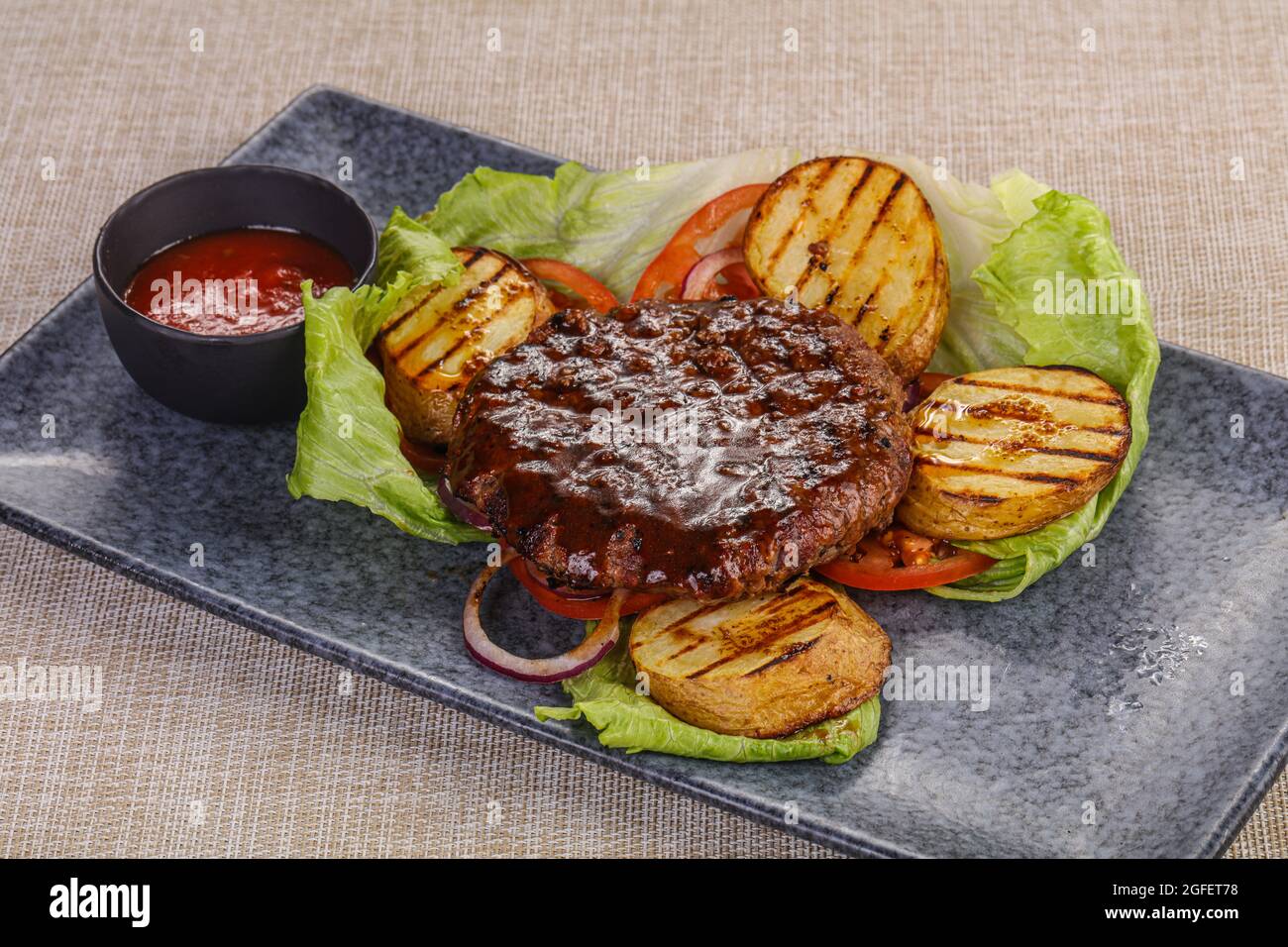 Grilled Beef cutlet with vegetables served onion Stock Photo - Alamy