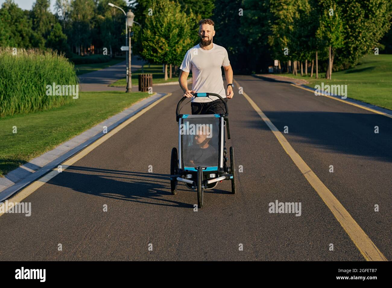 Father son jogging park hi-res stock photography and images - Alamy