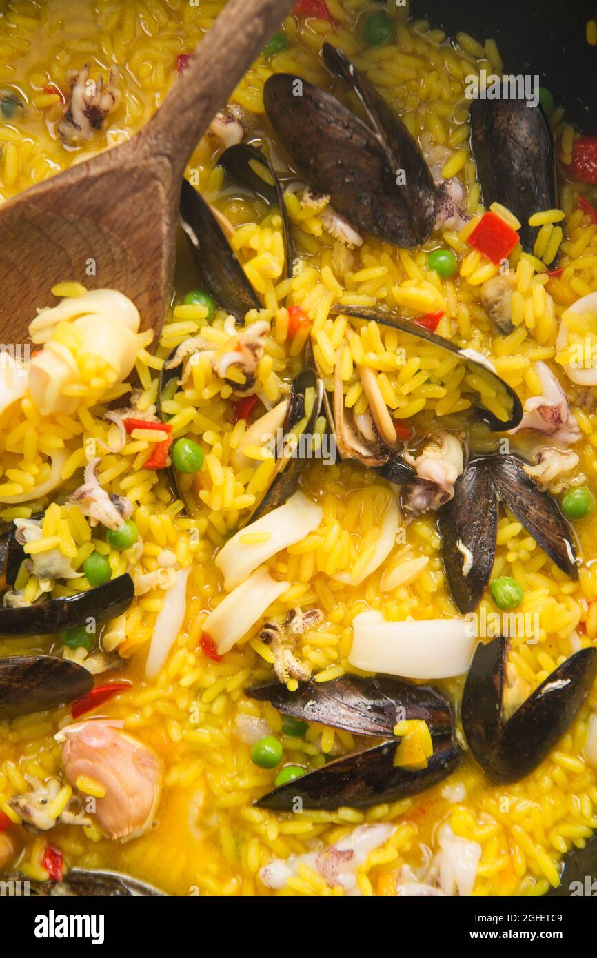 Presentation of a dish of Spain, paella being cooked Stock Photo - Alamy