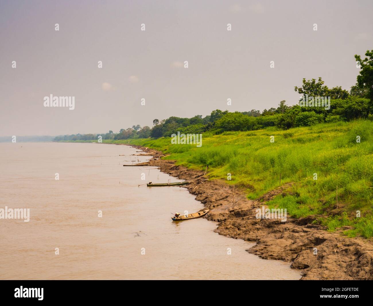 Small wooden boats on the banks of the Amazon River, Peru. Amazonia ...