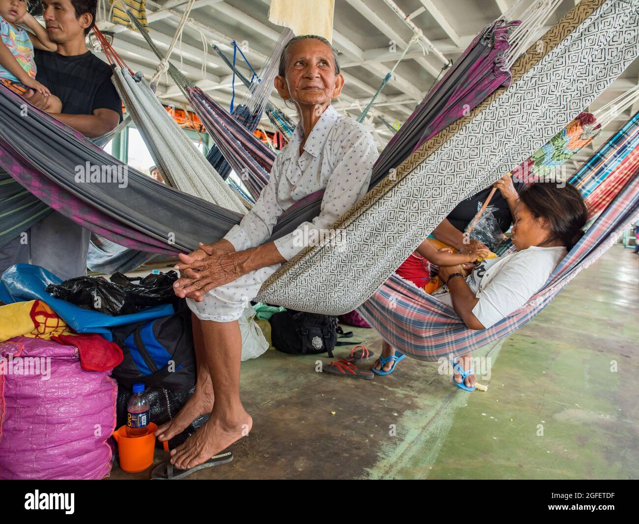 Amazon River, Peru - Sep, 2019: Old woman and many beautiful, colorful ...