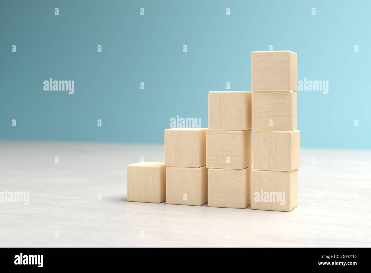 Wooden cubes piled onto each other in rising stacks. Can be used to put ...