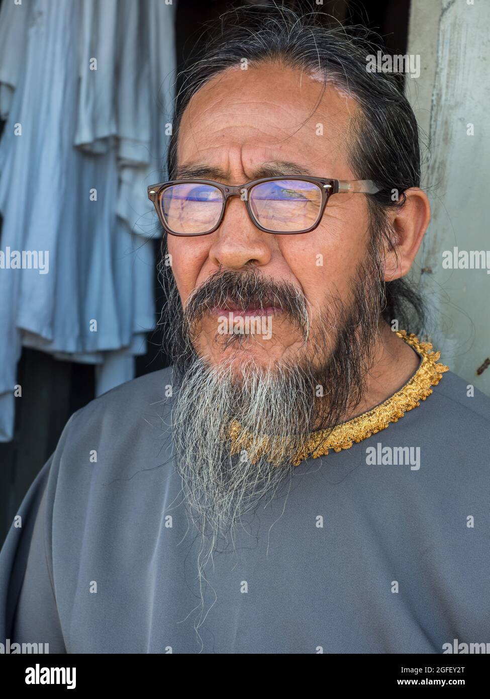 Pueblo, Peru - Mar 2018: Portrait of a preacher with a short gray beard ...