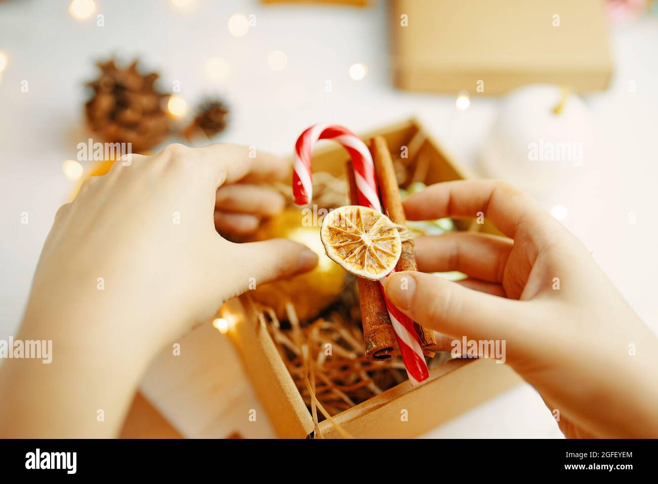 Woman puts candy cane hi-res stock photography and images - Alamy
