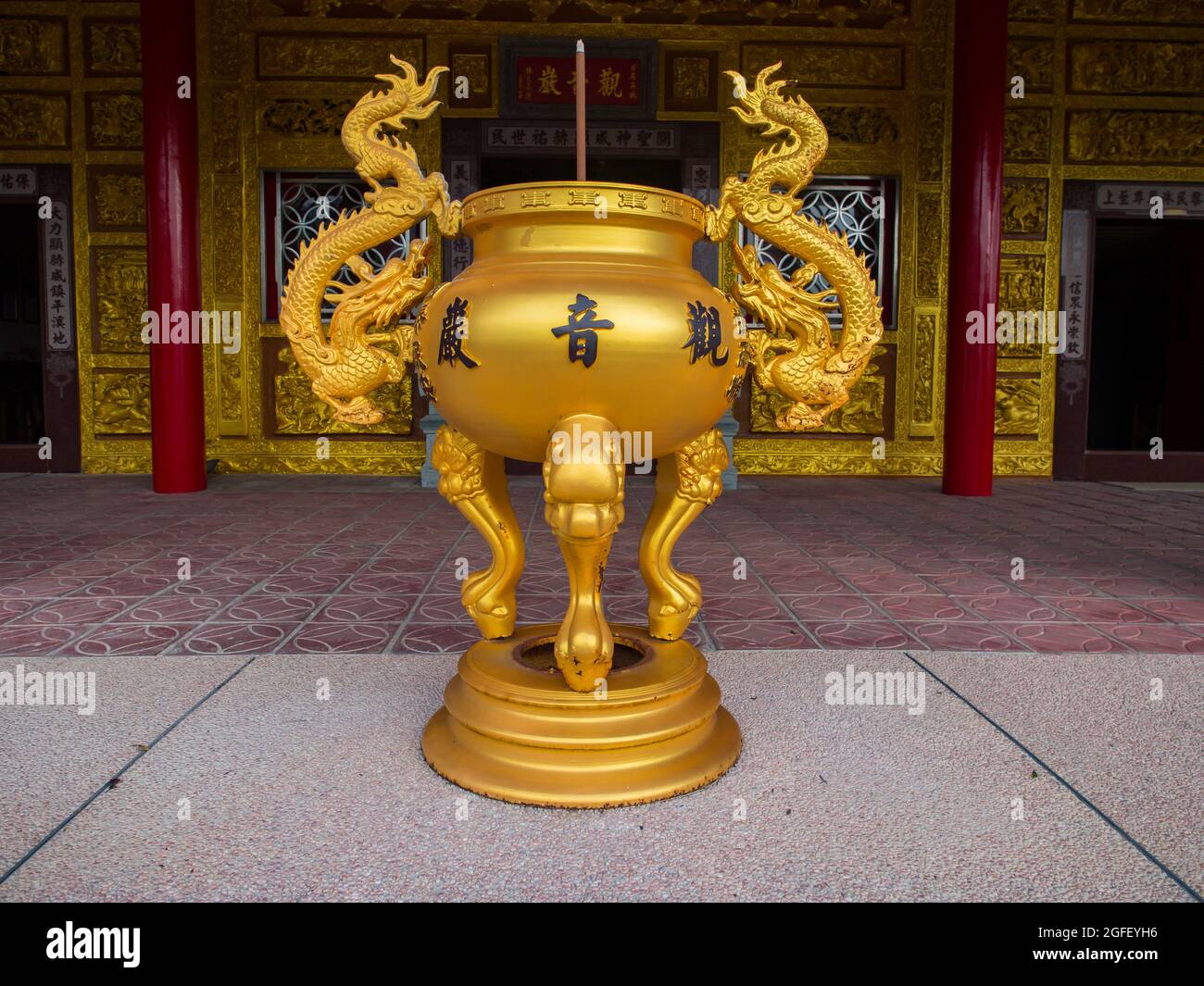 Taipei, Taiwan - October 2016: Golden censer in front of a small chapel ...