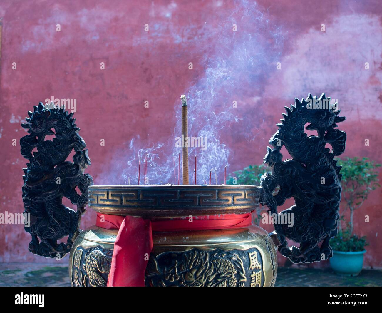 Taipei, Taiwan - October 2016: Golden censer in front of a small chapel ...