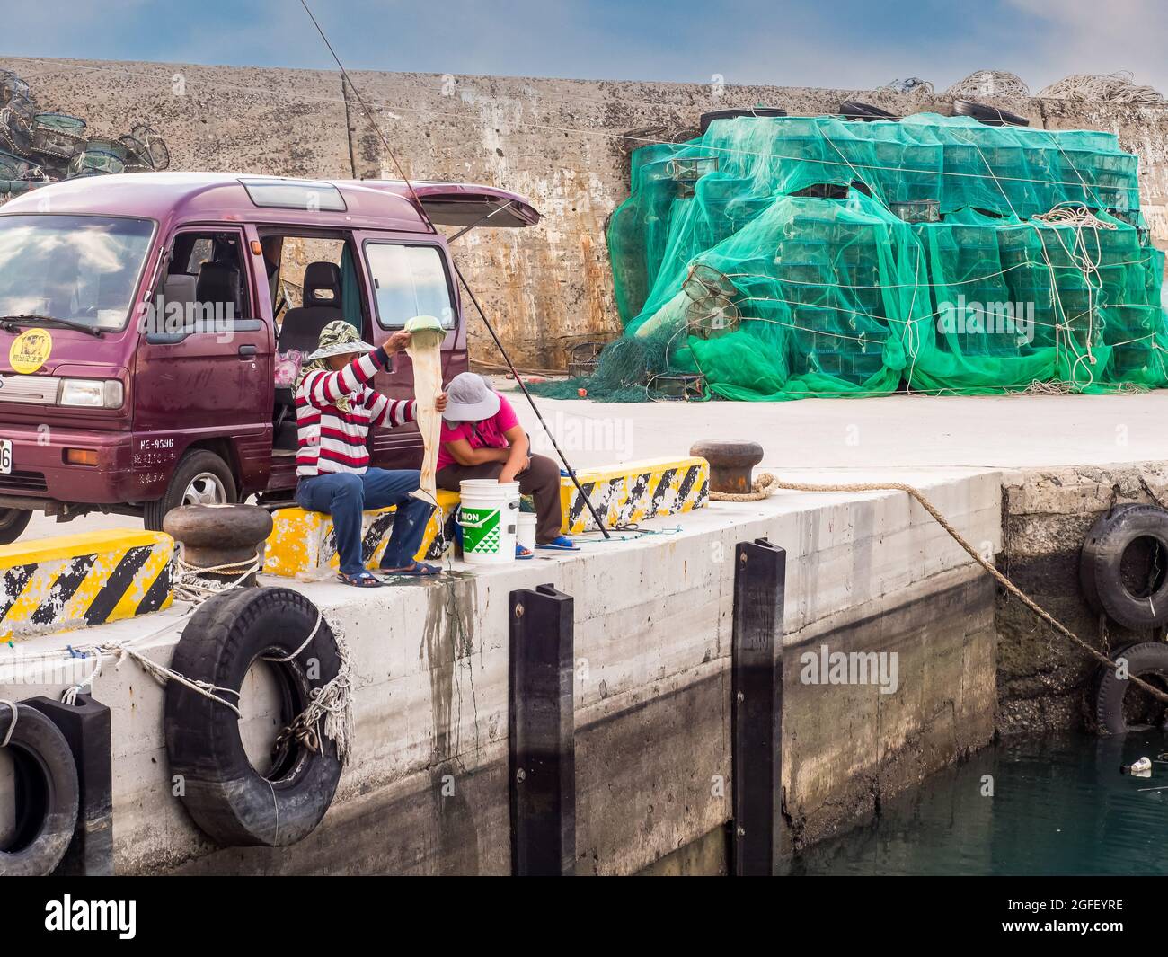 Fuji, Taiwan - October 2016: Life in the Fuji Fishing Harbour. Fishing ...