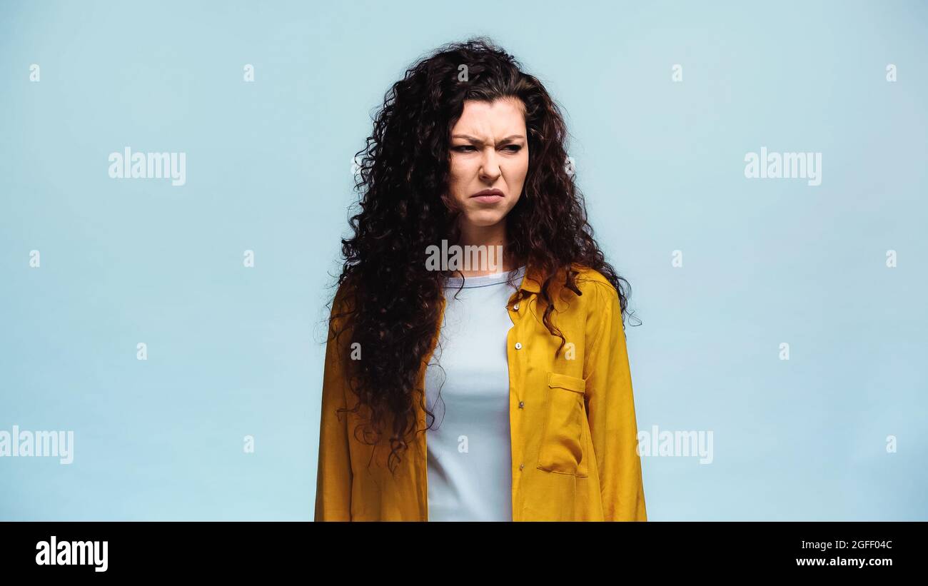 Young woman curly hair frowning hi-res stock photography and images - Alamy