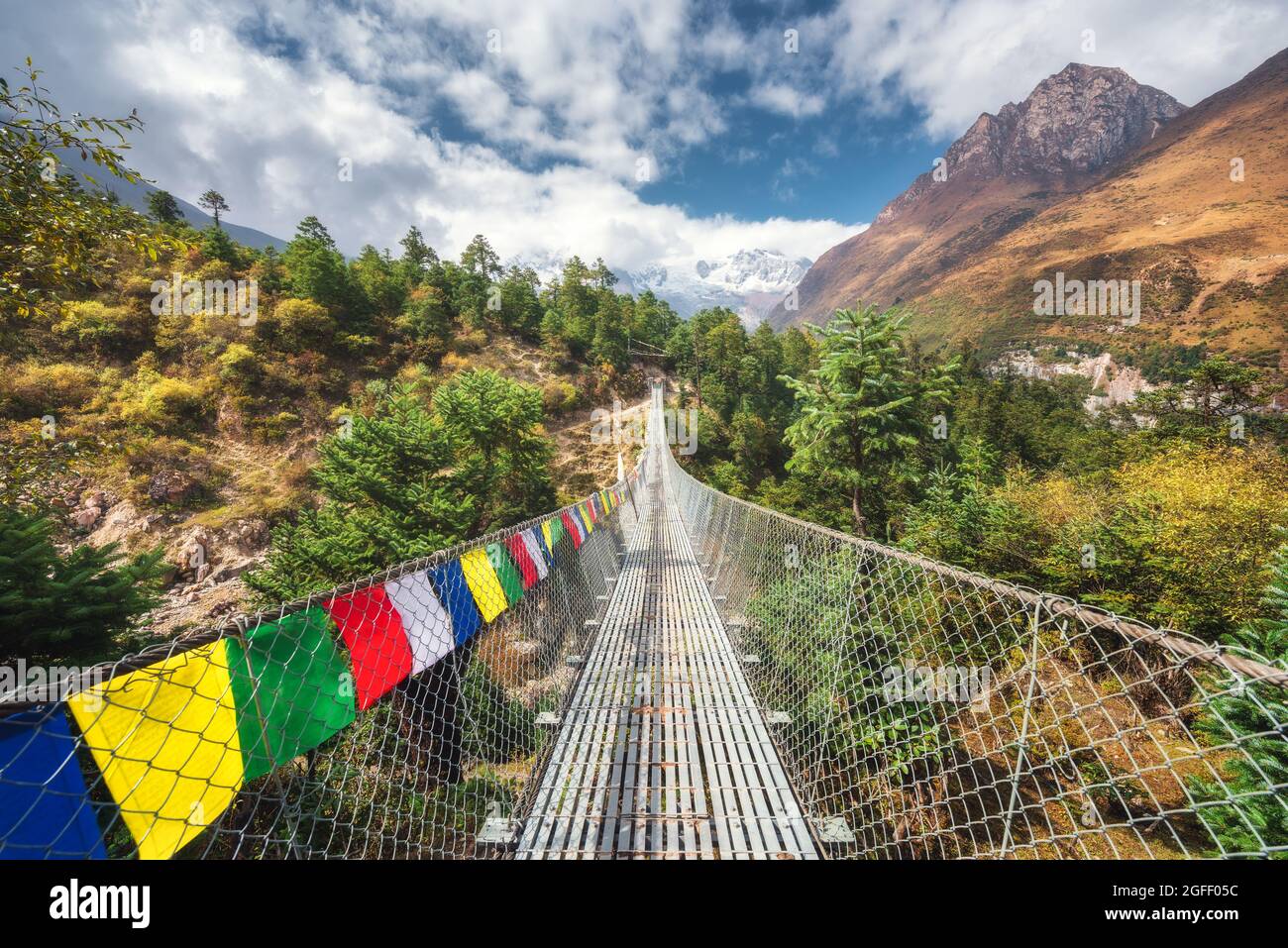 Suspension bridge and beautiful himalayan mountains at sunset Stock ...