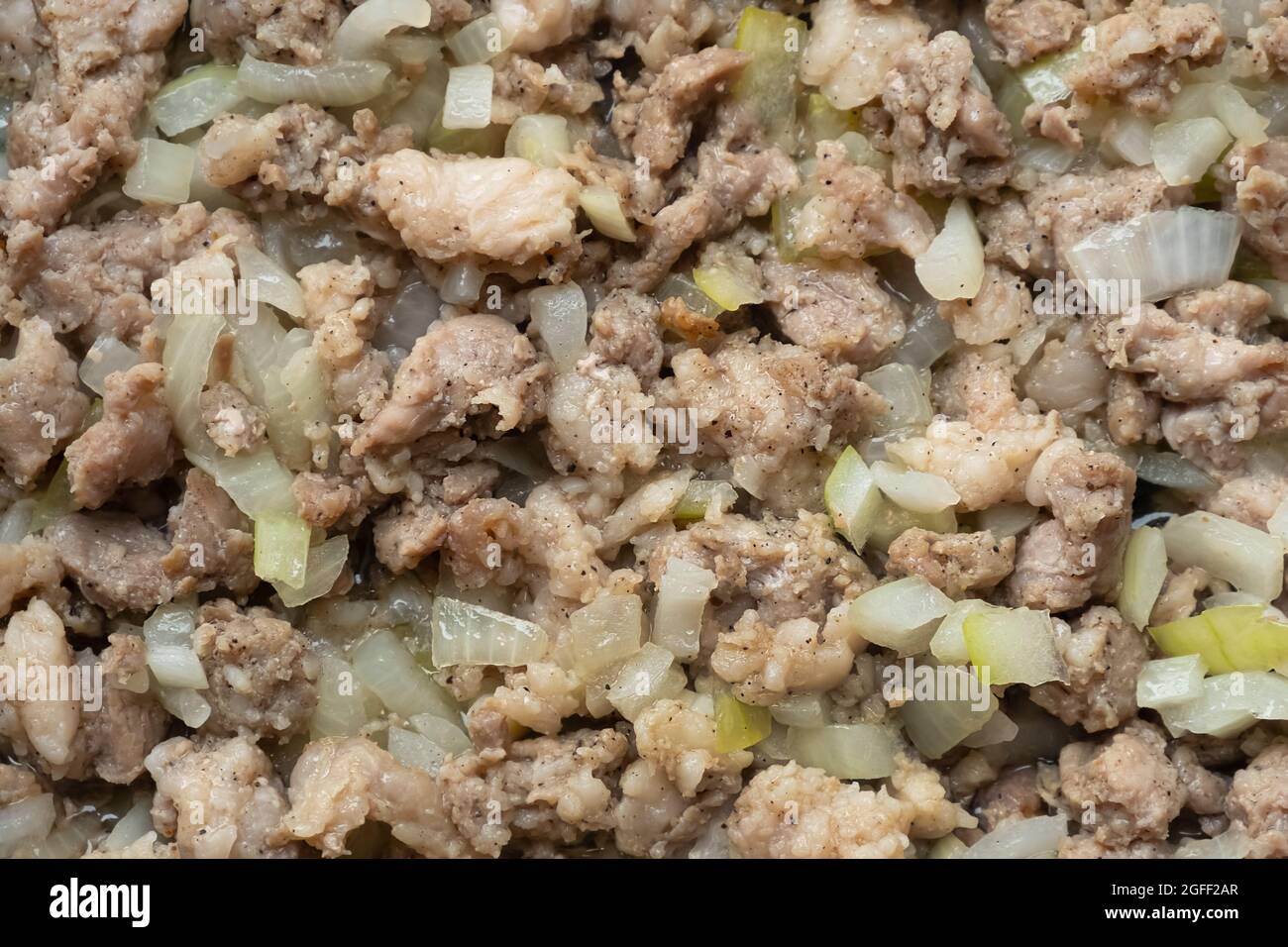 fried minced meat with onions in a frying pan, finely chopped meat ...