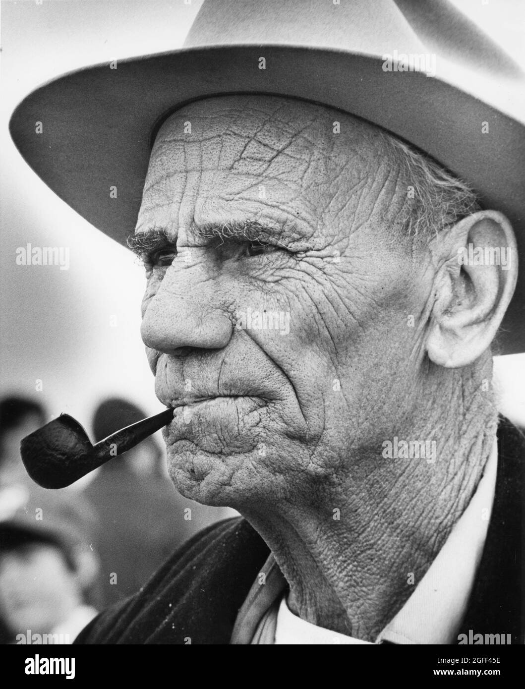 Bryan Texas USA, circa 1978: Man with lined face smoking a pipe and ...