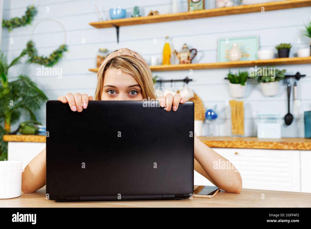 Woman peeking table hi-res stock photography and images - Alamy