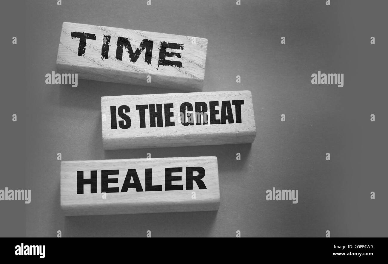 Time is the best healer words on wooden blocks. End of relationship and ...