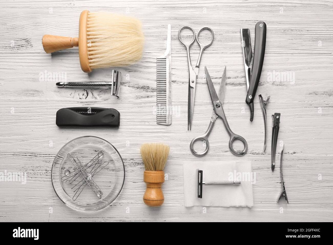 Vintage tools of barber shop on light wooden background Stock Photo - Alamy