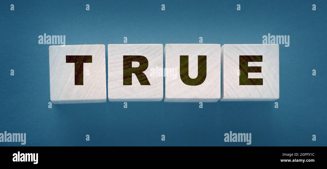 concept word true on wooden cubes on black background Stock Photo - Alamy