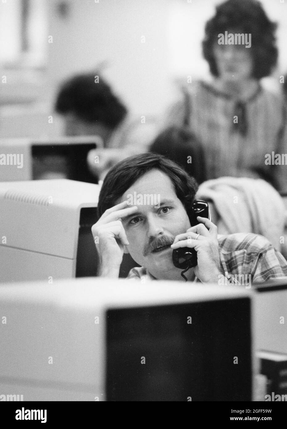 Austin Texas USA, circa 1984: Male news reporter has phone conversation ...