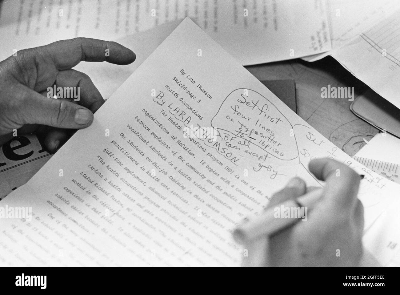 Austin Texas USA, circa 1991: Texas high school teacher editing student ...