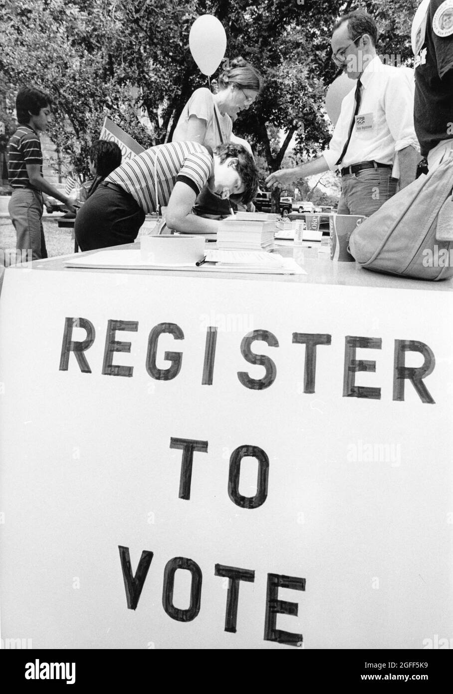 Austin Texas USA, circa 1992: People sign up to vote during voter ...