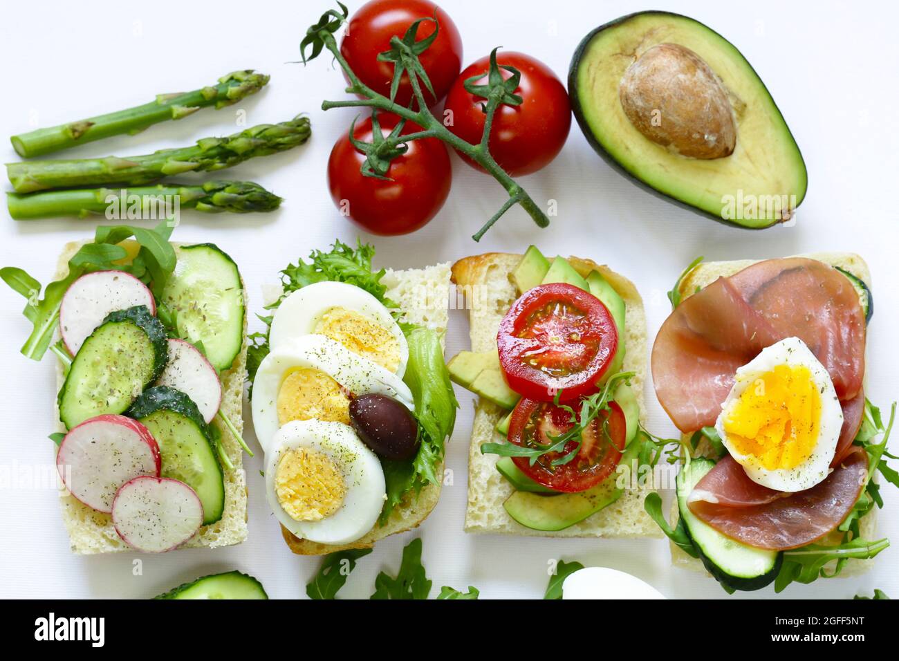 sandwiches with different fillings - vegetables, ham and egg Stock ...