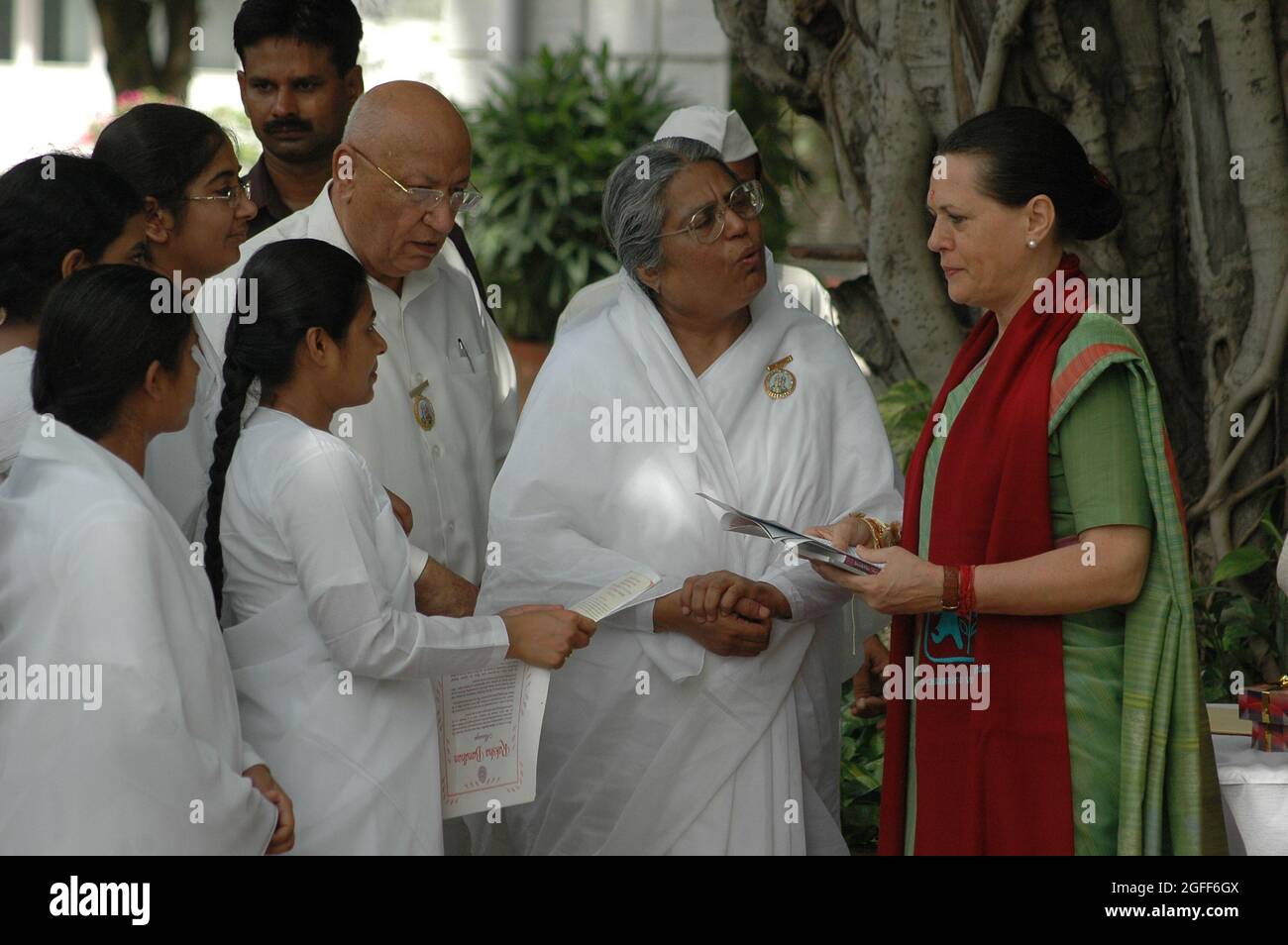 Asha, Director, Om Shanti Retreat Centre of the Brahma Kumari sect tying Rakhi to Sonia Gandhi ...