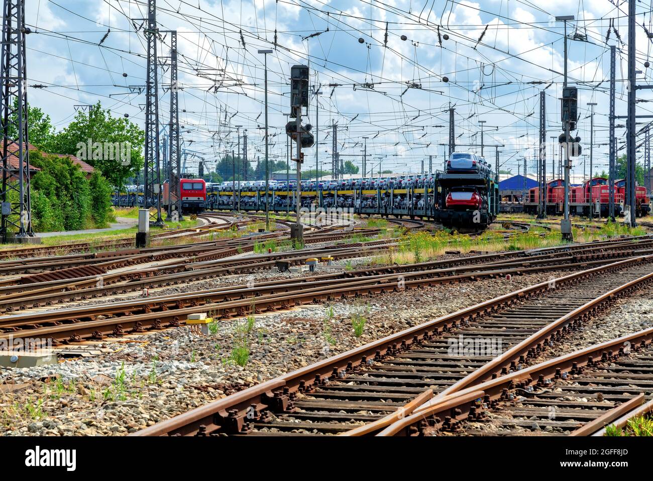 Transportation of cars by train. Autorack with cars. Loaded cars ready ...