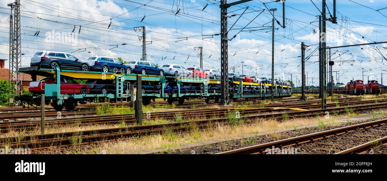 Transportation of cars by train. Autorack with cars. Loaded cars ready ...
