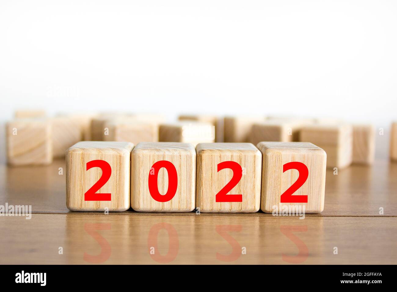 2022 happy new year symbol. Wooden cubes symbolize the change from 2021 ...