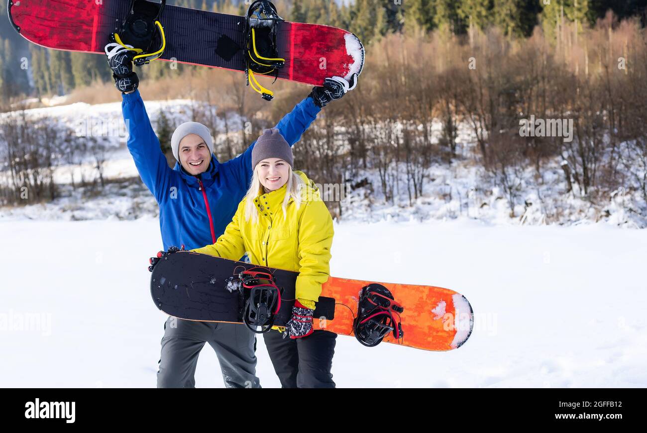 family with snowboards at winter resort Stock Photo - Alamy