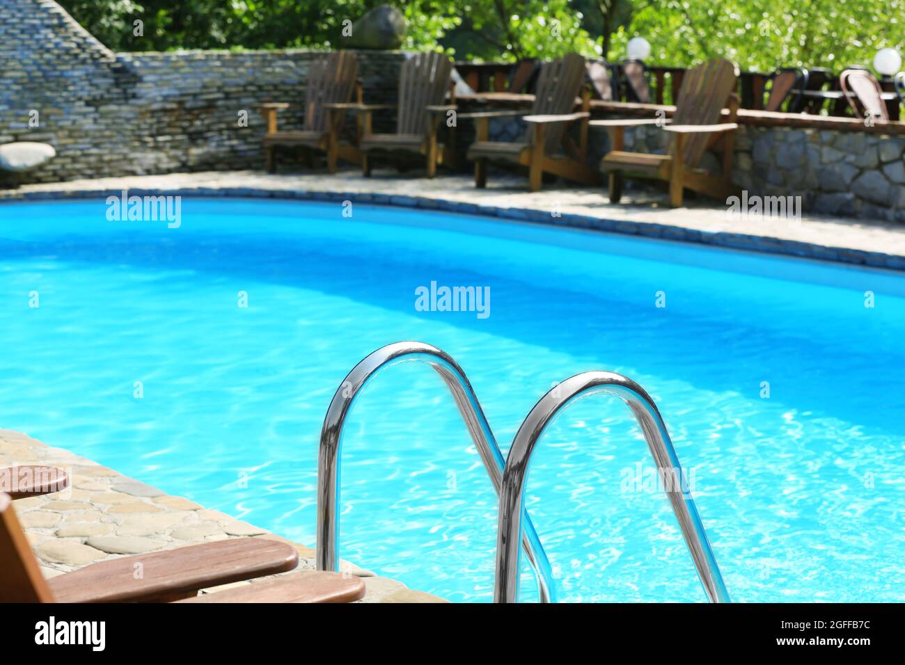 Swimming pool in summer yard Stock Photo - Alamy
