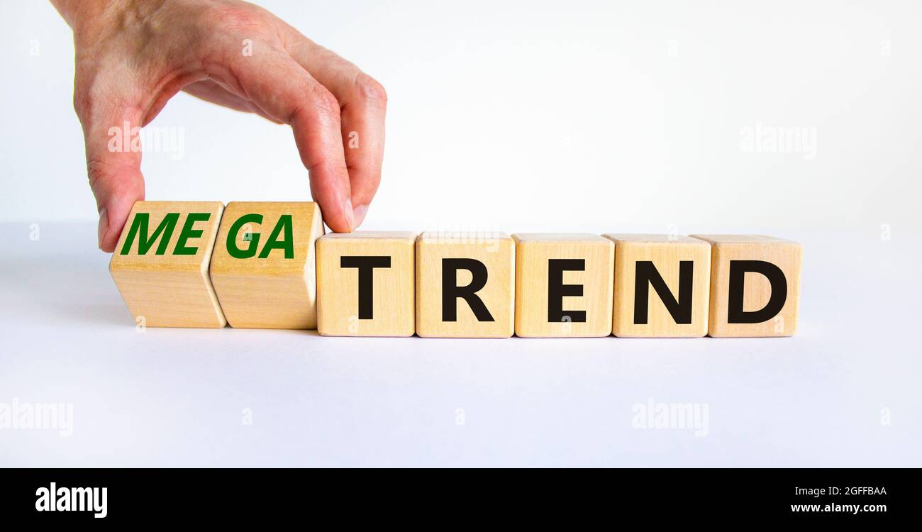 Trend or megatrend symbol. Businessman turns wooden cubes and changes ...