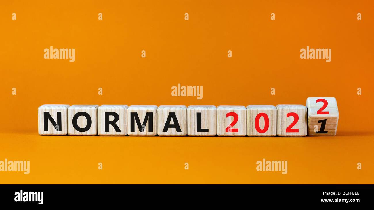 Symbol of covid-19 normal in 2022. Turned a wooden cube and changed ...