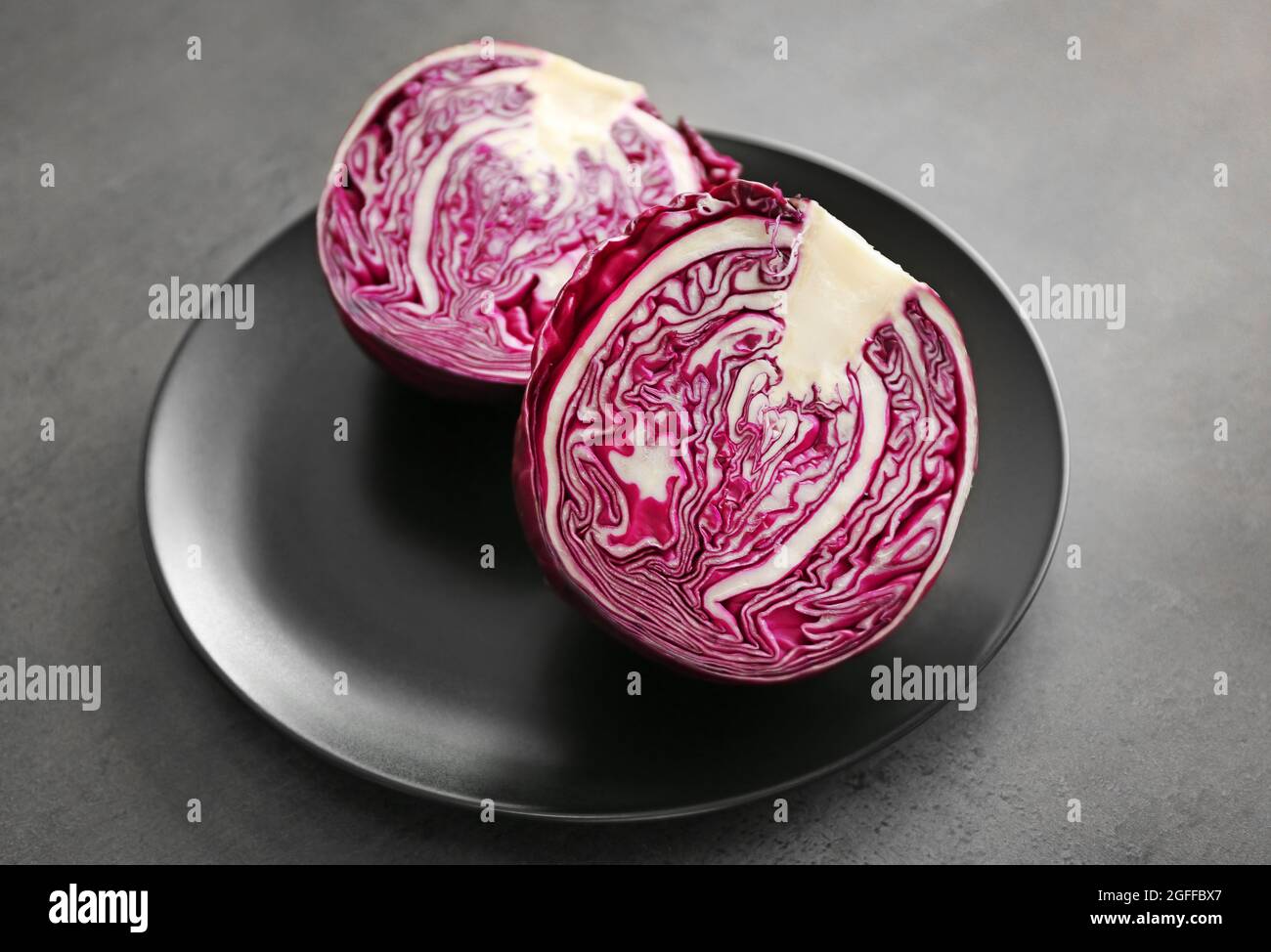 Red cabbage on plate, grey background Stock Photo - Alamy