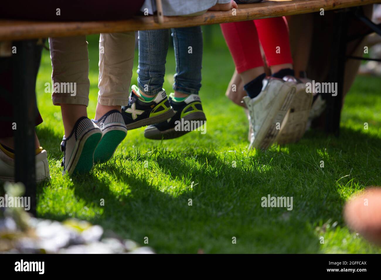 Feet hanging in air on grass hi-res stock photography and images - Alamy