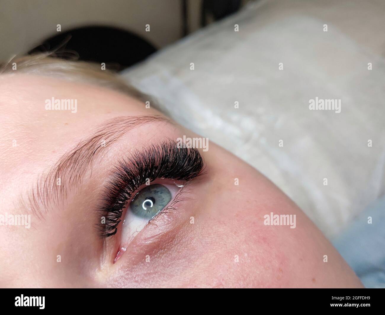 Lash extensions in beauty salon macro eye top view . High quality photo ...