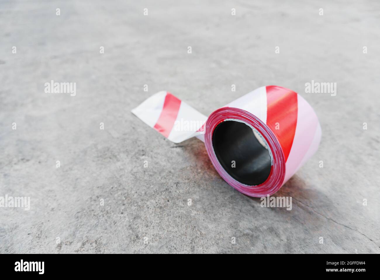 A roll of red and white Signal tape to safely fence off an area on the ...
