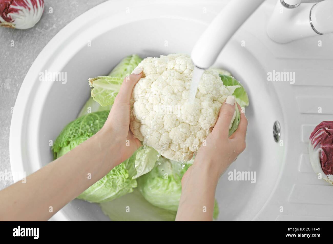 Female hands wash cabbage Stock Photo - Alamy