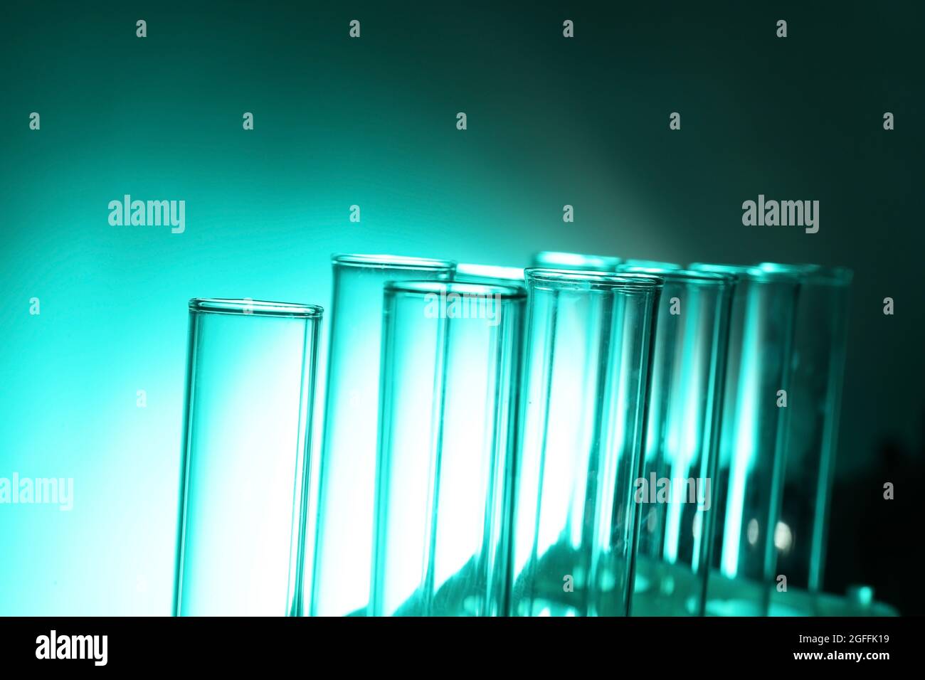 Test tubes on dark background Stock Photo - Alamy
