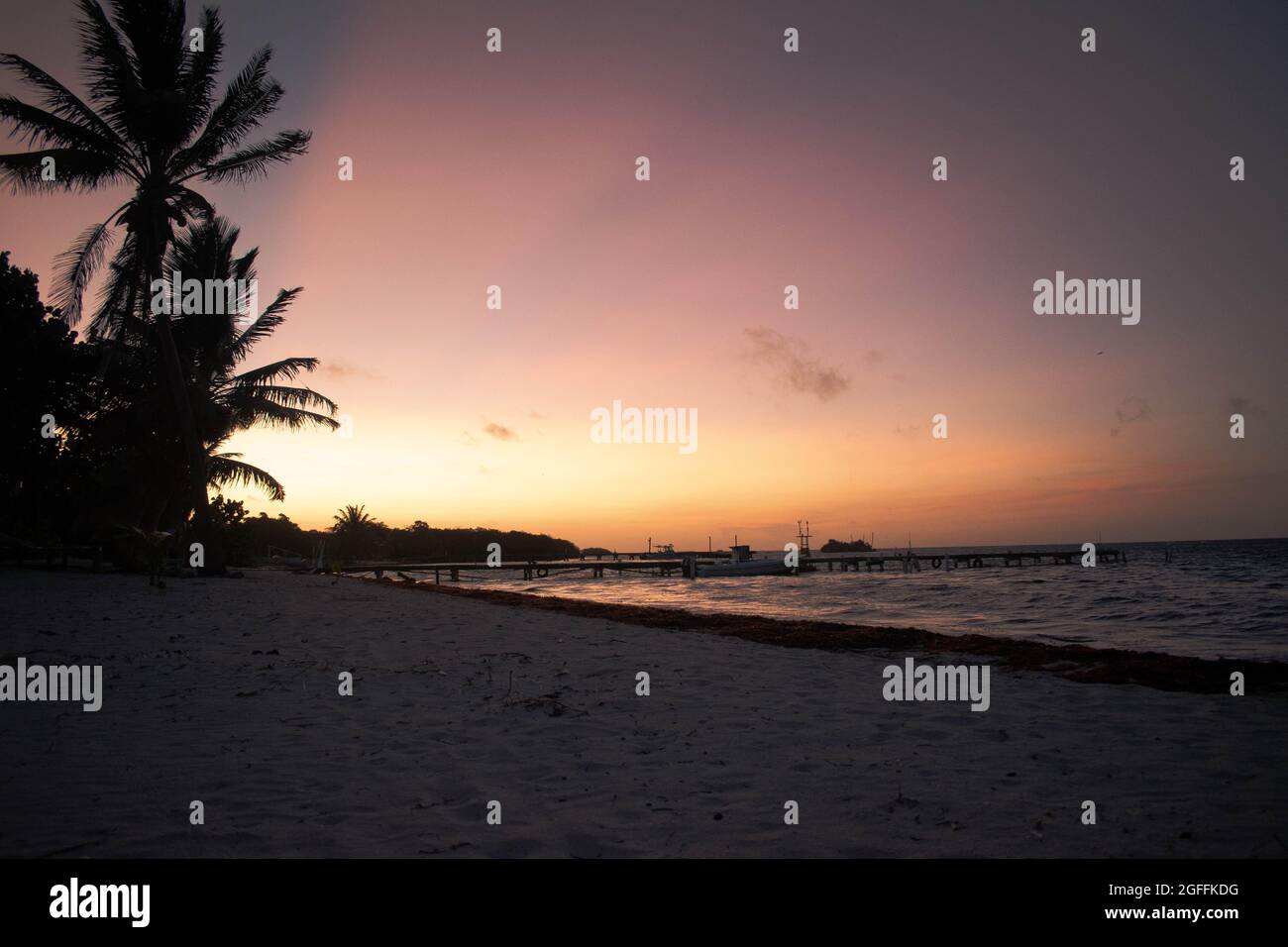 Sunrise in Calabash Caye, Turneffe Atoll, Belize Stock Photo - Alamy