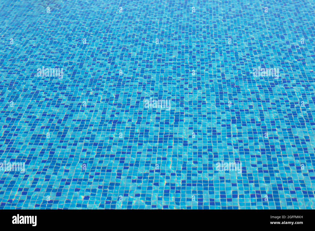 Blue water with mosaic bottom in pool Stock Photo - Alamy