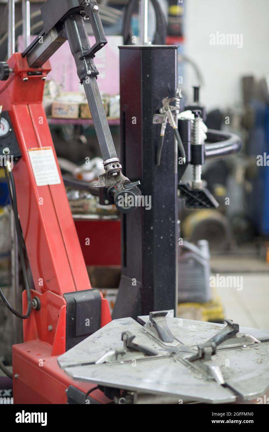 Machine for changing car tire fitting. Wheel tyre repairing Stock Photo ...