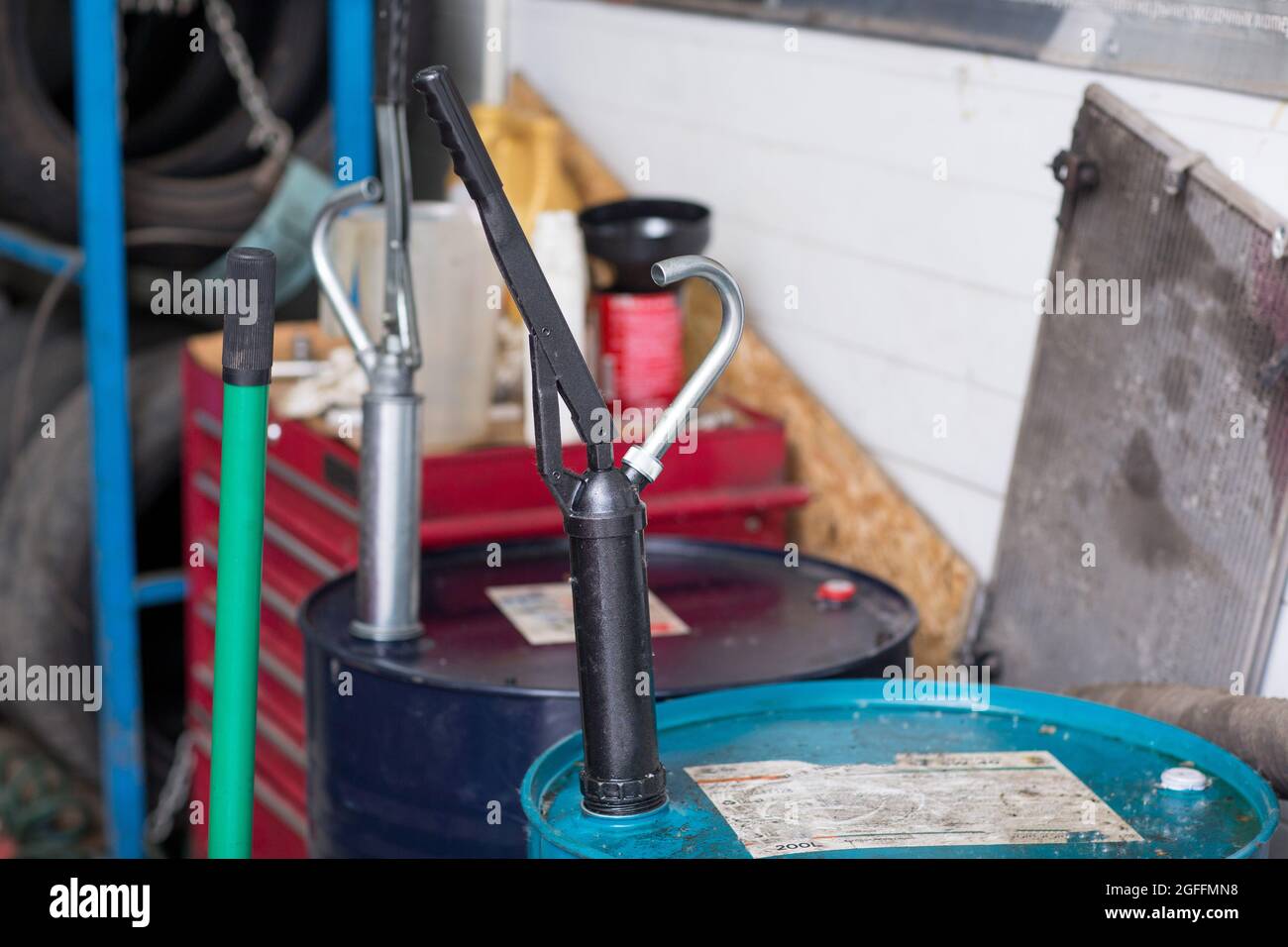 Service station. Oil Barrel for car engine Stock Photo - Alamy