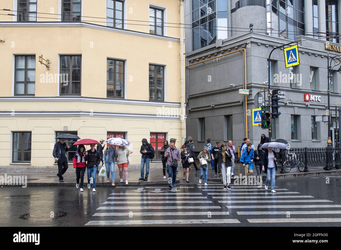 Saint Petersburg, Russia - 9 August 2021, People cross the road on a ...