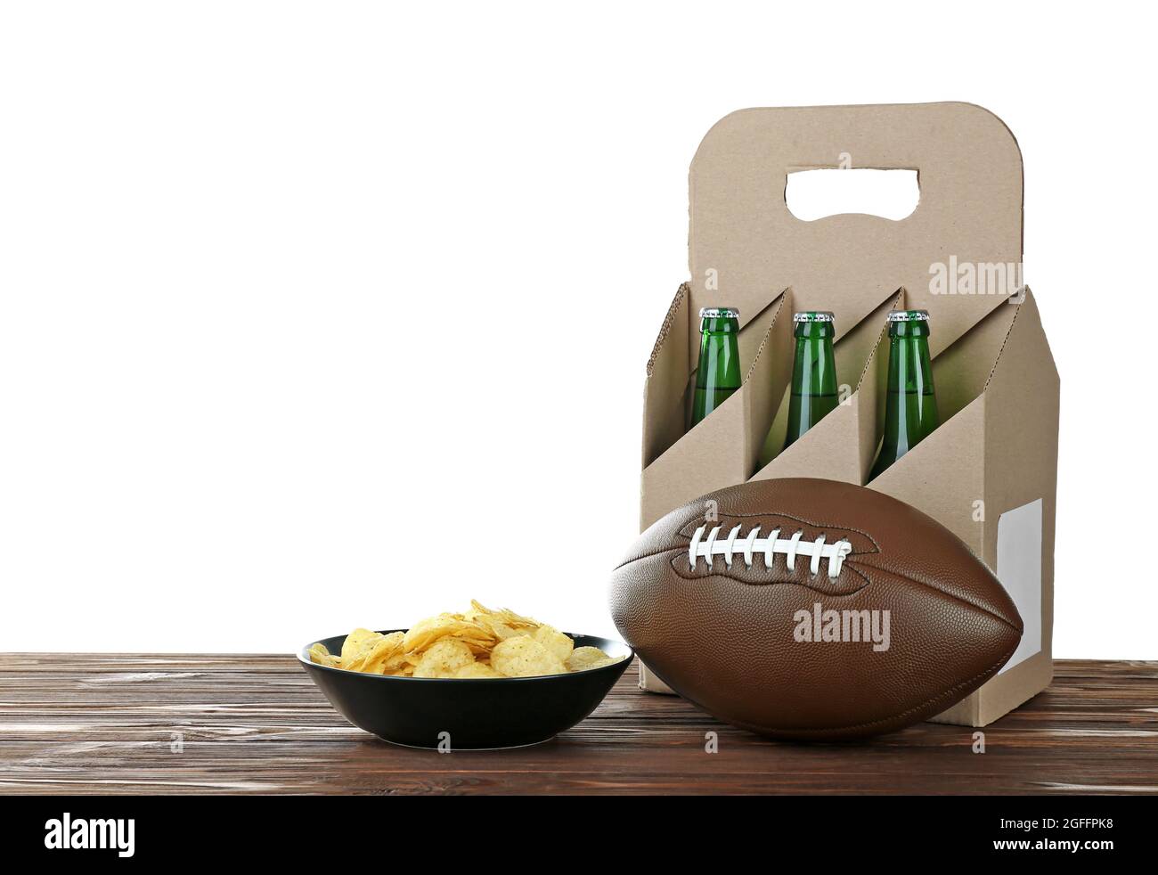 Six pack of beer, ball and snack on wooden table with white background ...